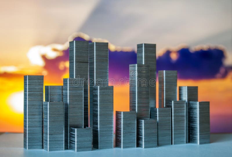 Staples Arranged To Form City Skyline on a Sunset Background Stock ...