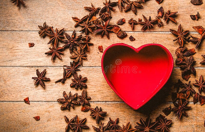 Star Anise and Heart Shape Gift Box on Wooden Table Stock Photo - Image ...