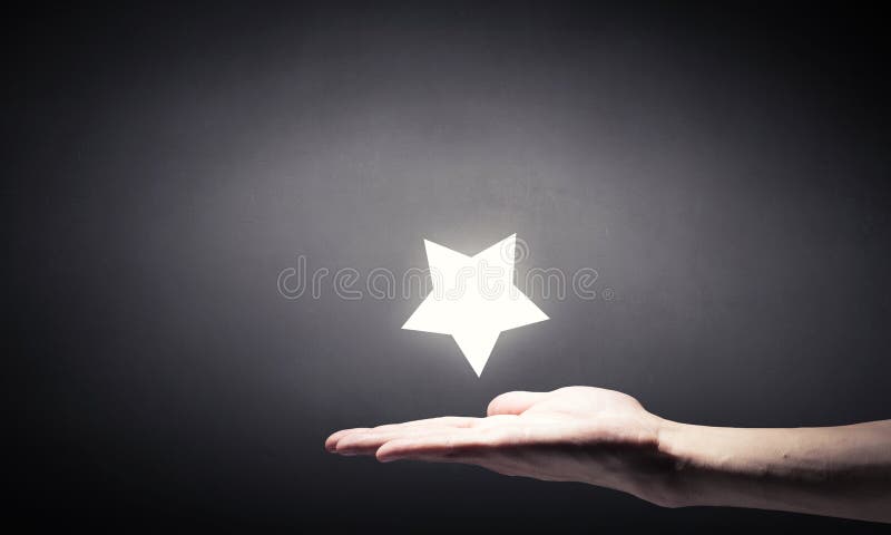 Star in hand stock photo. Image of glow, star, palm, light - 94837650