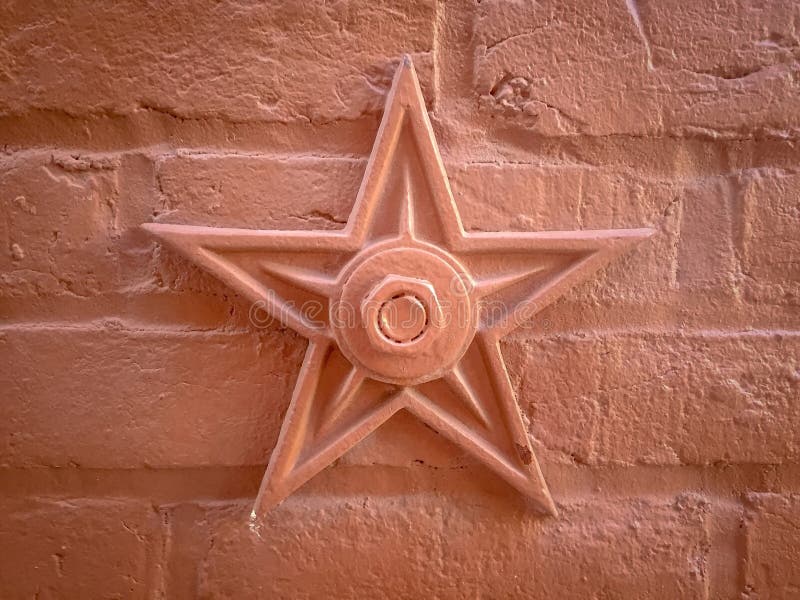 Red Brick Wall with Star Detail Stock Photo - Image of modern, facade ...