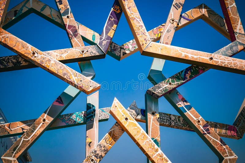 Star Sculpture Shines with an Iridescent Surface, Reflecting a Spectrum ...