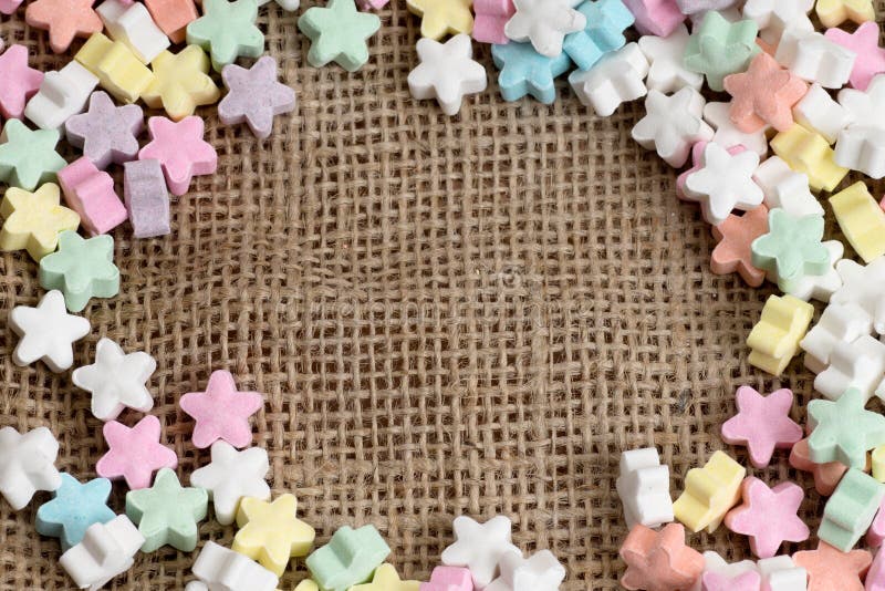 Star Shape Candy on Burlap Background Texture. Stock Photo - Image of ...