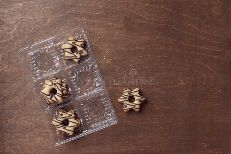 Star-shaped Cookie with Chocolate in the Plastic Box on the Wooden ...