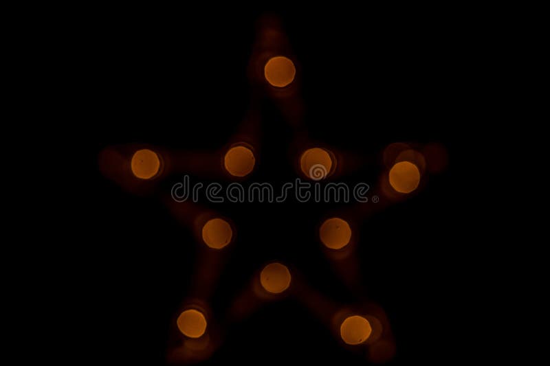 Star Shaped Diffused Light on Black Background Closeup Stock Photo ...