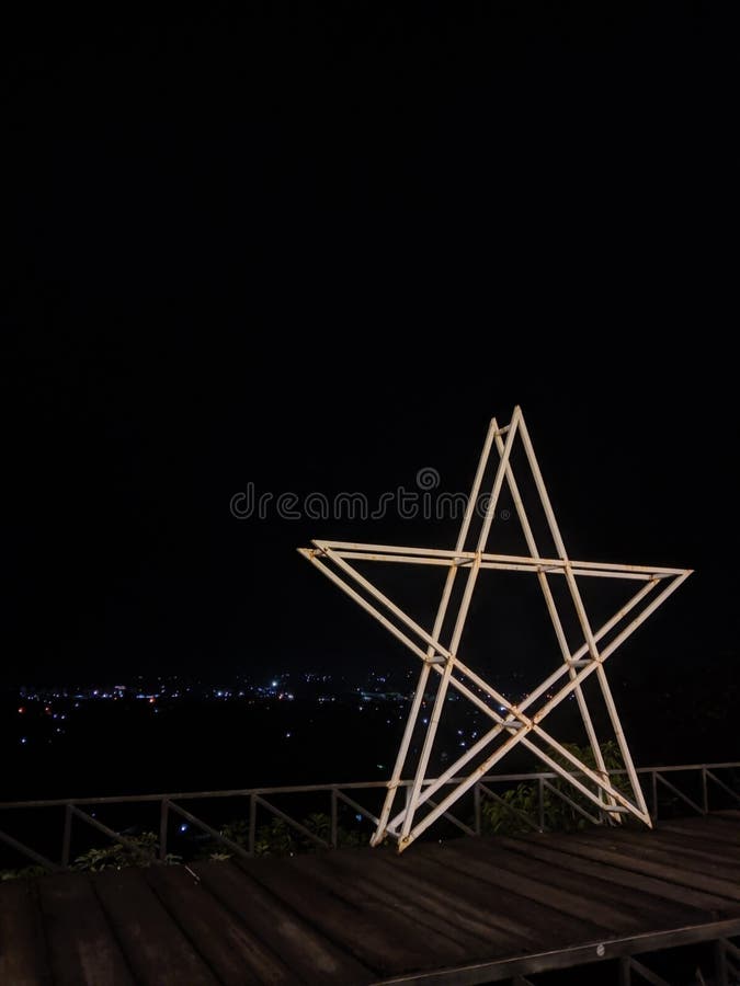 A Star-shaped Frame at Night Accompanied by Sparkling Lights Stock ...