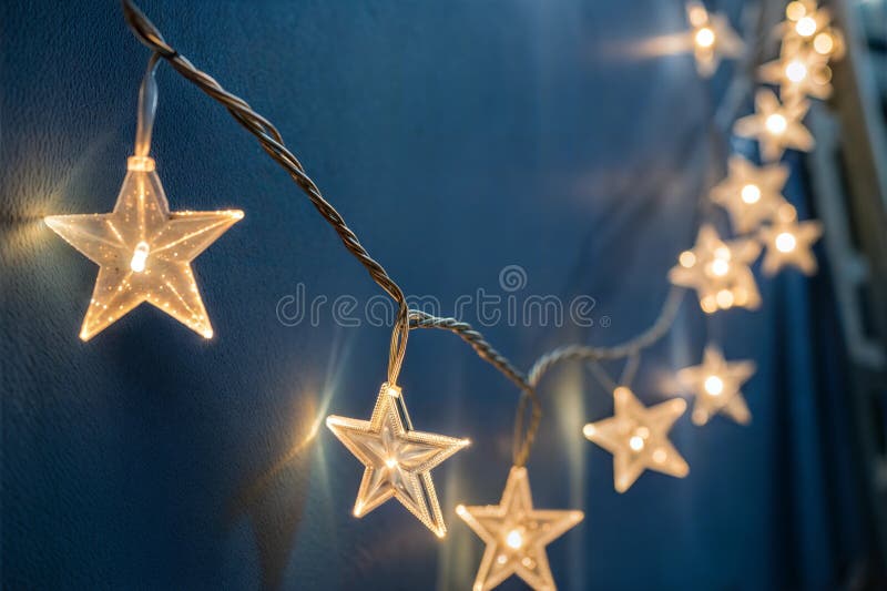 Star-shaped String Lights Illuminate a Dark Wall, Creating a Festive ...