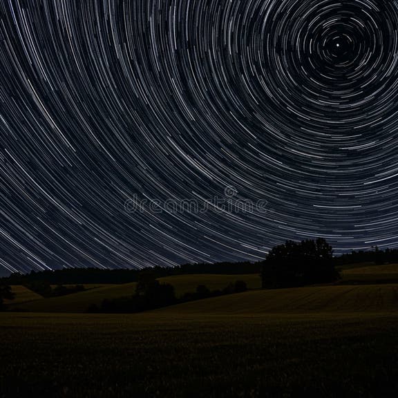 Star Trails Create Circular Patterns in the Night Sky Over a Dark ...