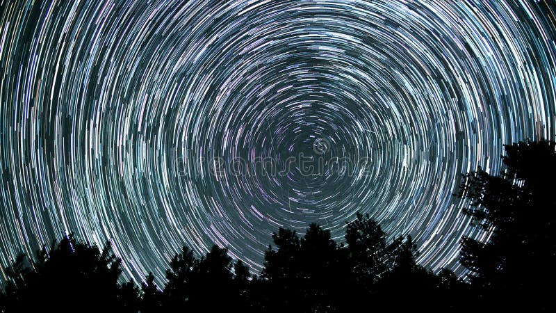Beautiful Star Trails Over Dark Forest at Night in Remote Location ...