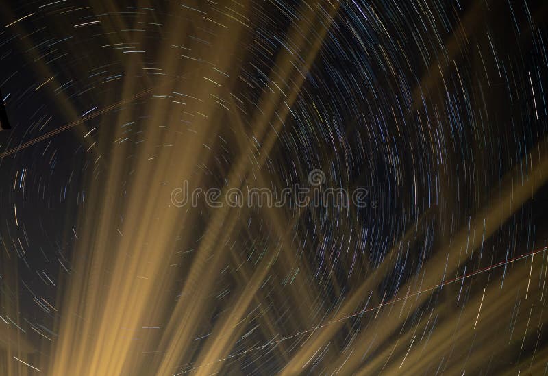 Star Trails with Plane Trails and Light Beams Stock Image - Image of ...