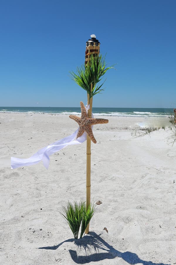 Starfish Decor on Tiki Torch Stock Image - Image of beach, wedding ...