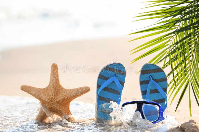 Starfish and Flip-flops on Sea Beach at Tropical Resort Stock Photo ...