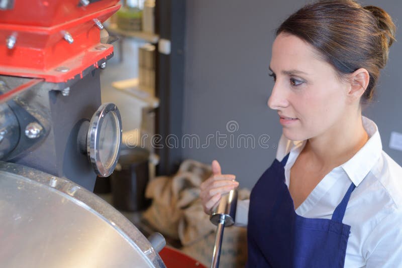 Staring at machine`s gauge stock image. Image of apron - 93905891