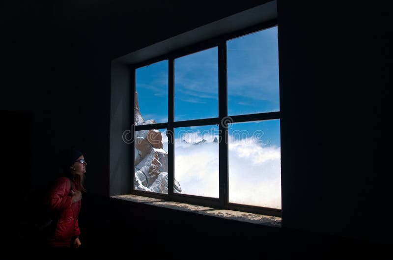 Staring at the window stock photo. Image of dark, mont - 15282796