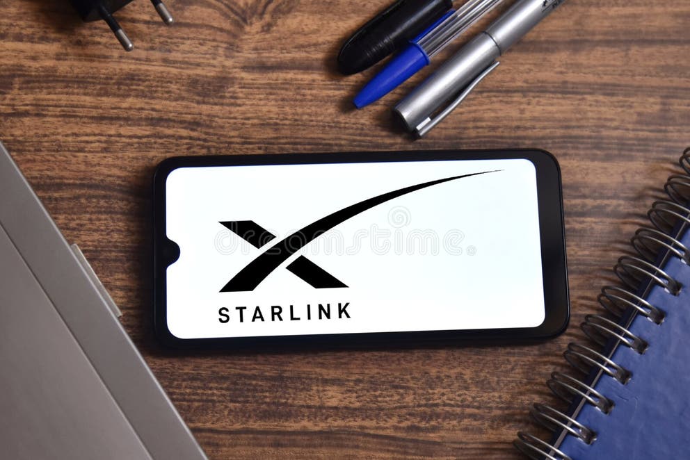 The Starlink Logo is Seen on a Smartphone Screen on a Table with ...