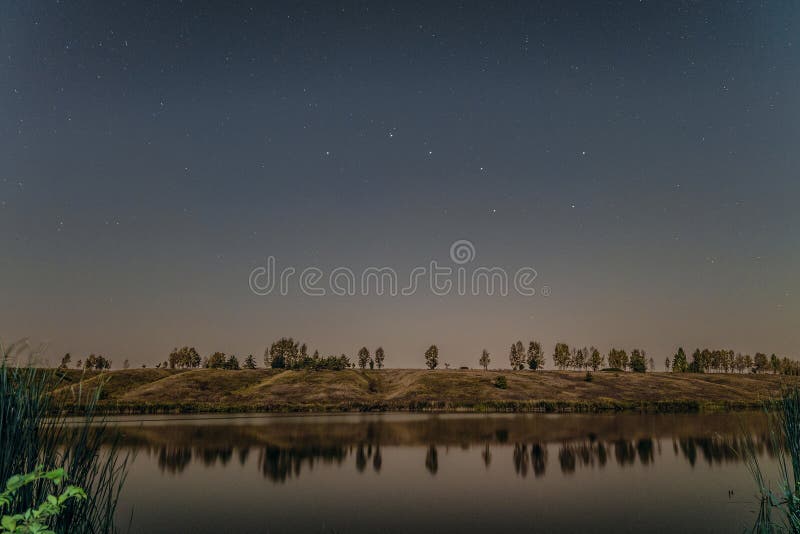 Starry night over the lake stock photo. Image of outdoors - 93826732