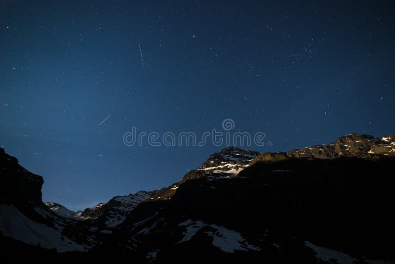The Starry Sky on the Alps Illuminated by Moonlight. Expansive Night ...