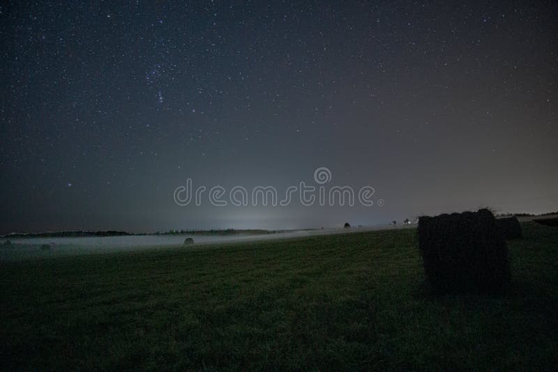 Starry sky over the field. stock photo. Image of tree - 199984156