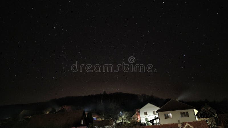 Starry Sky Over Night Village Stock Photo - Image of star, streetlight ...