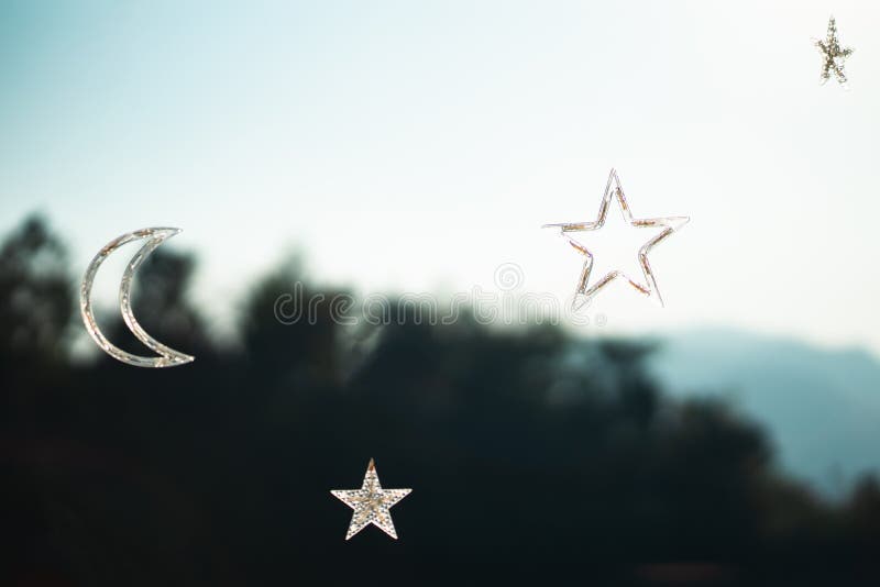 Stars and Half Moon Float on a Pastel Blue and White Background Stock ...