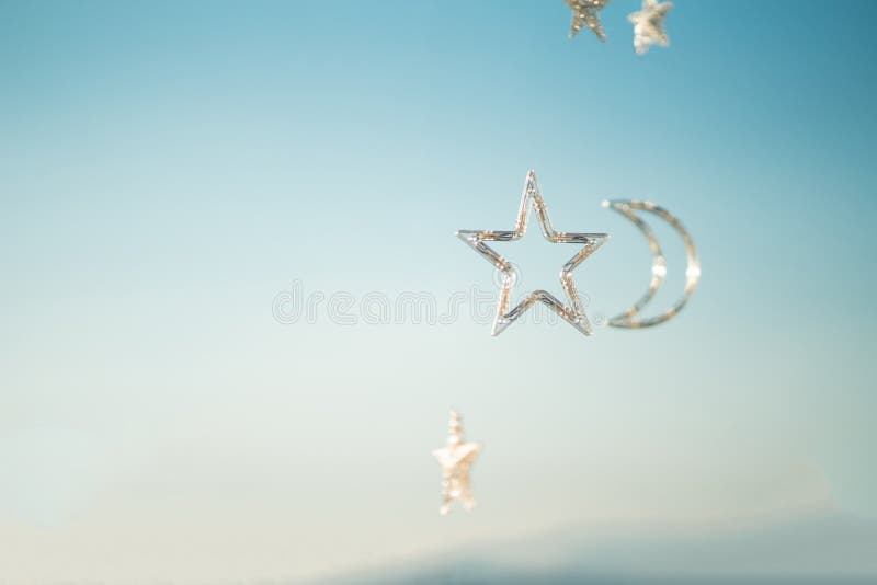 Stars and Half Moon Float on a Pastel Blue and White Background Stock ...