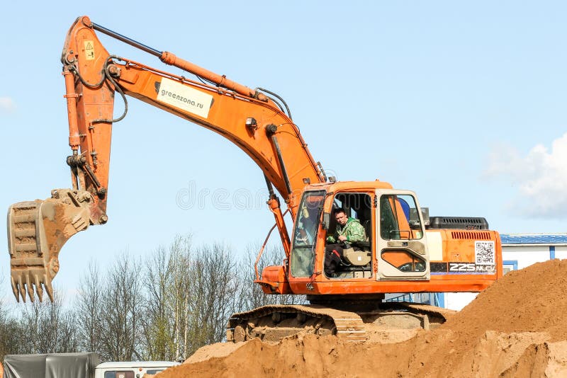 The Driver Controls the Operation of the Excavator Editorial Photo ...