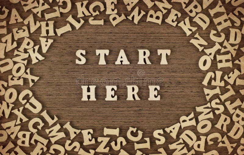 Start Here Wooden Phrase stock photo. Image of discussion - 260791298