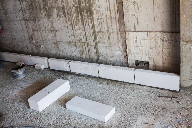 Start,masonry of White Brick Wall for Construction. Stock Image - Image ...