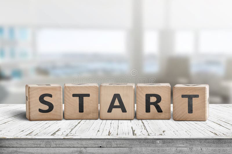 Start Sign in a Bright Office on a Wooden Table Stock Image - Image of ...