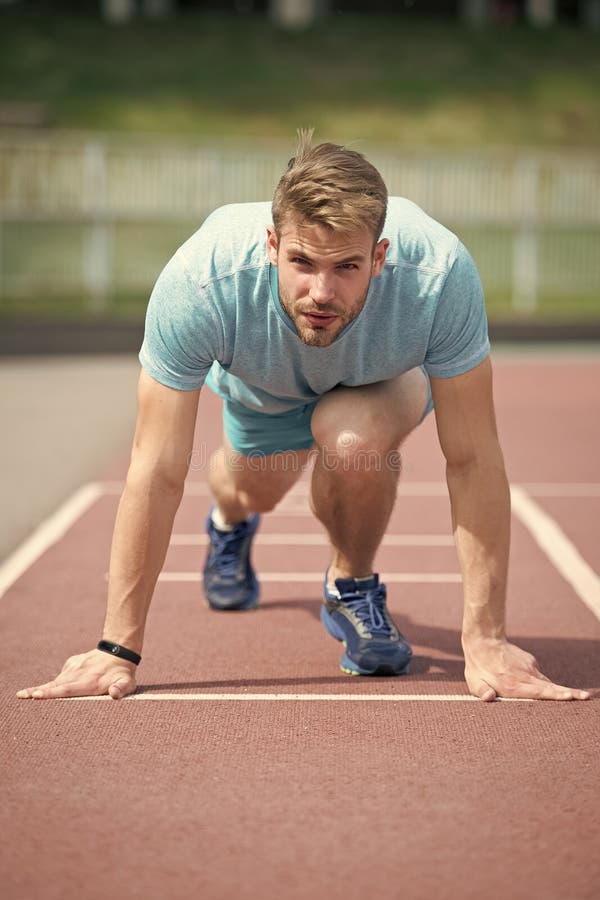 Start of Sport Career. Man Runner on Start Position Stadium Background ... Start of Sport Career. Man Runner on Start Position Stadium Background ...