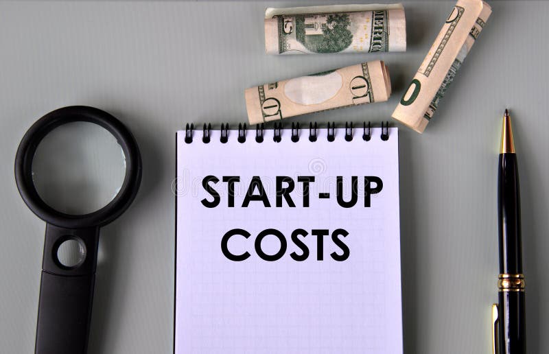START-UP COSTS - Words in a Notebook Against the Background of a Pen ...