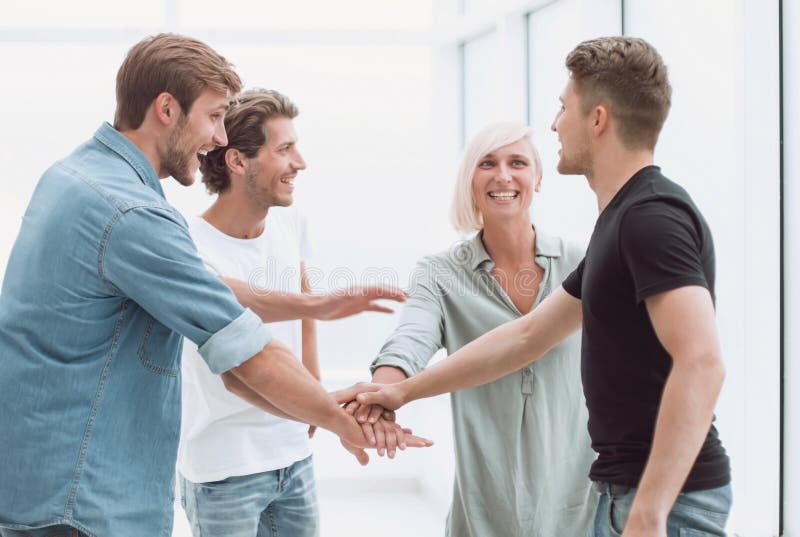 Start-up. Smiling Co-workers Putting Their Hands Together. Stock Image ...