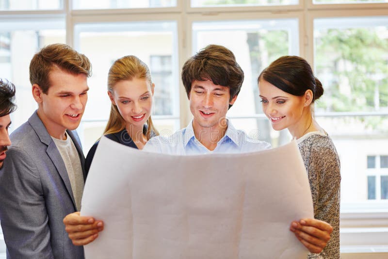 Architect looking at plans stock photo. Image of face - 15455016