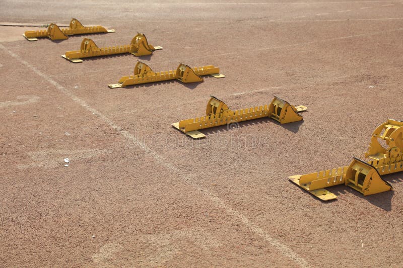 Starting Blocks in the Plastic Stock Photo - Image of feature, stadium ...