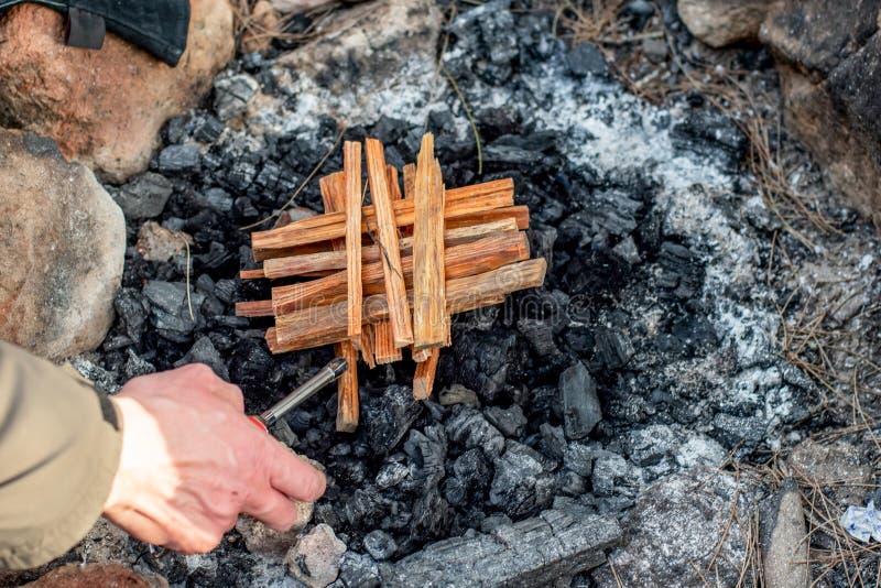Starting the Camp Fire with Kindling. Camping Life Stock Image - Image ...