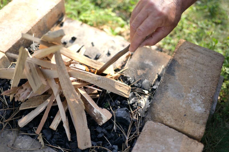 Starting a Campfire with Kindling in a Brick Fire Pit Stock Image ...