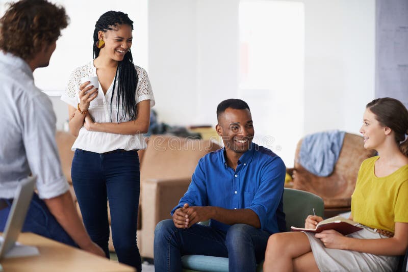 Starting the Day with a Meeting. a Group of Young Coworkers Discussing ...