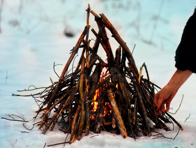 Starting a Fire in the Snow. Winter Stock Photo - Image of winter ...
