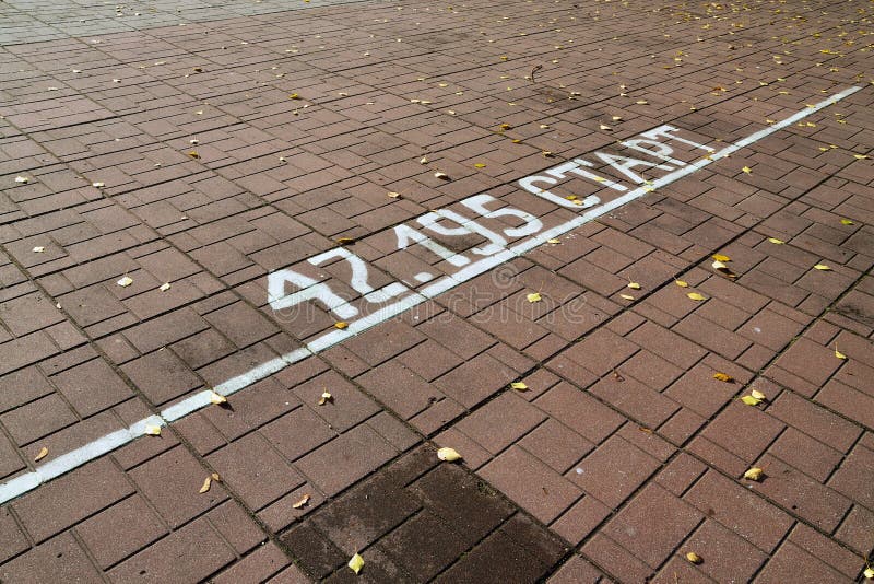 Starting Line of the Marathon Stock Photo - Image of leaves, white ...