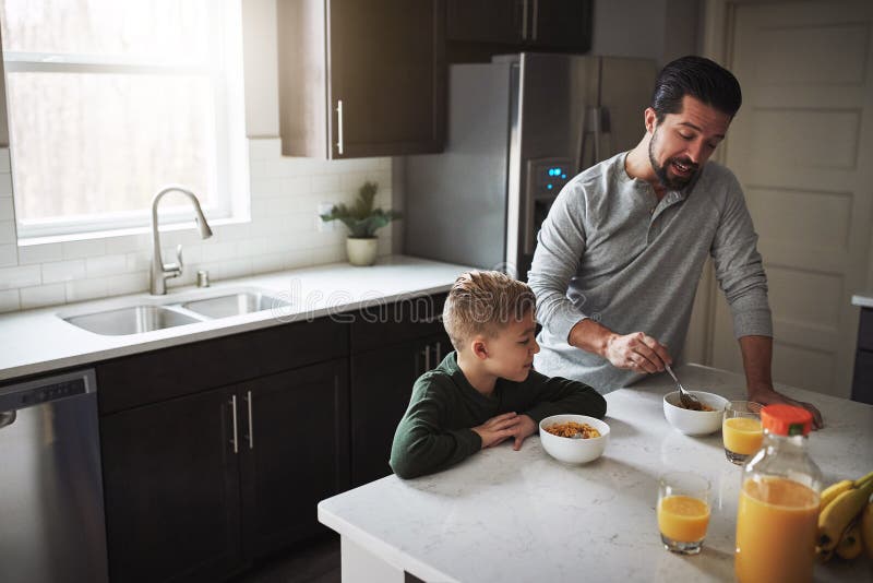 Starting Off the Day Properly. High Angle Shot of a Young Boy and His ...