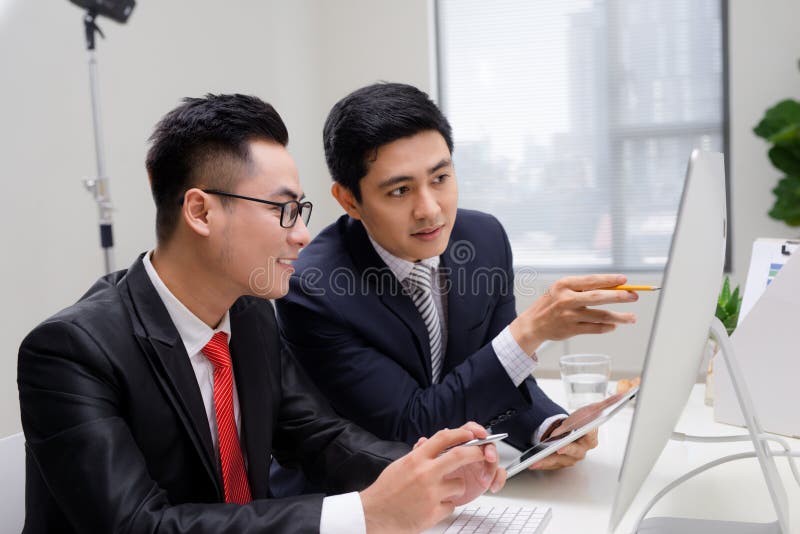 Startup Business Partners Working Together in Desktop Stock Image ...