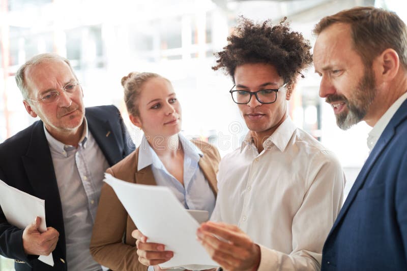 Startup Business Team and Consultants Read Business Plan Stock Image ...