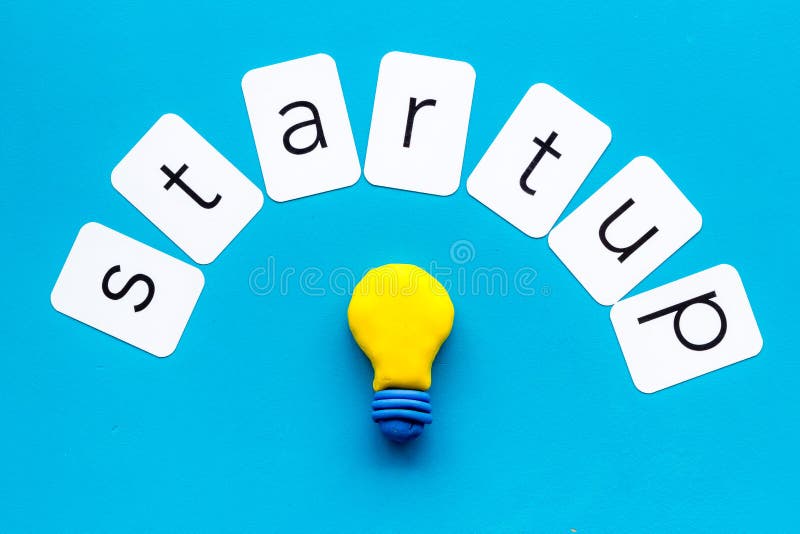Startup Concept with Bulb Icon on Blue Background Top-down Stock Photo ...