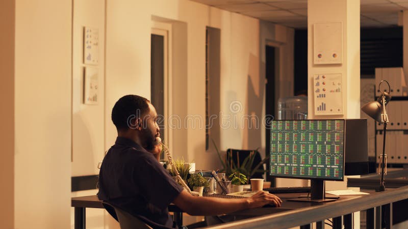 Startup Employee Answering Landline Phone Call in Office Stock Photo ...