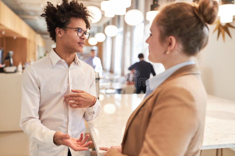 Startup Founder and Young Colleague Having Small Talk Stock Photo ...