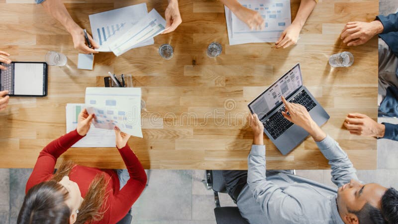 In the Startup Meeting Room Team of Entrepreneurs Sitting at the ...