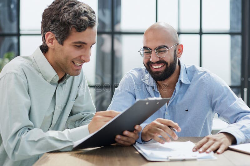 Startup Partners Discussing Project at Laptop, Watching Video ...
