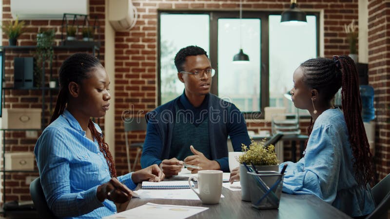Startup Workers Reviewing Documents Stock Footage - Video of group ...