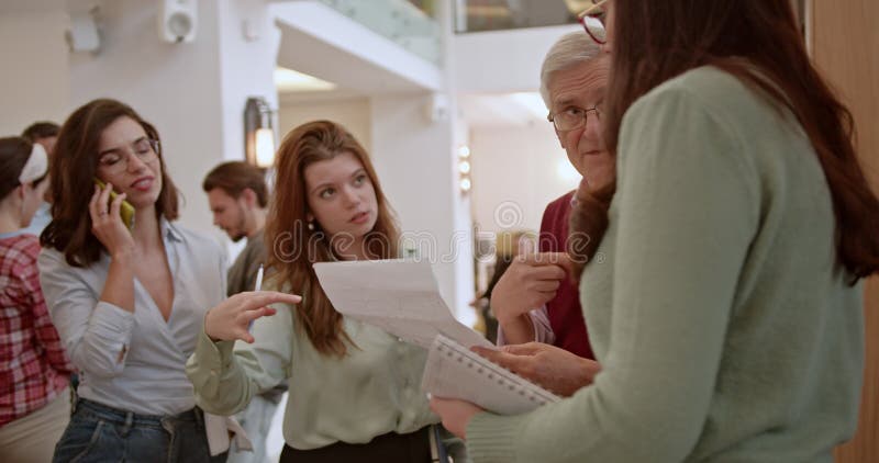 Multi Generational Team of People Engaging in a Collaborative ...