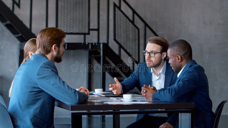 Startup Young Team Meeting at the Work Site To Discuss a Project Stock ...