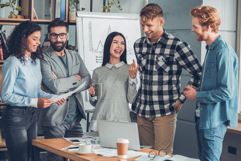Startupers Working Together At Office Standing Talking Smiling Laughing